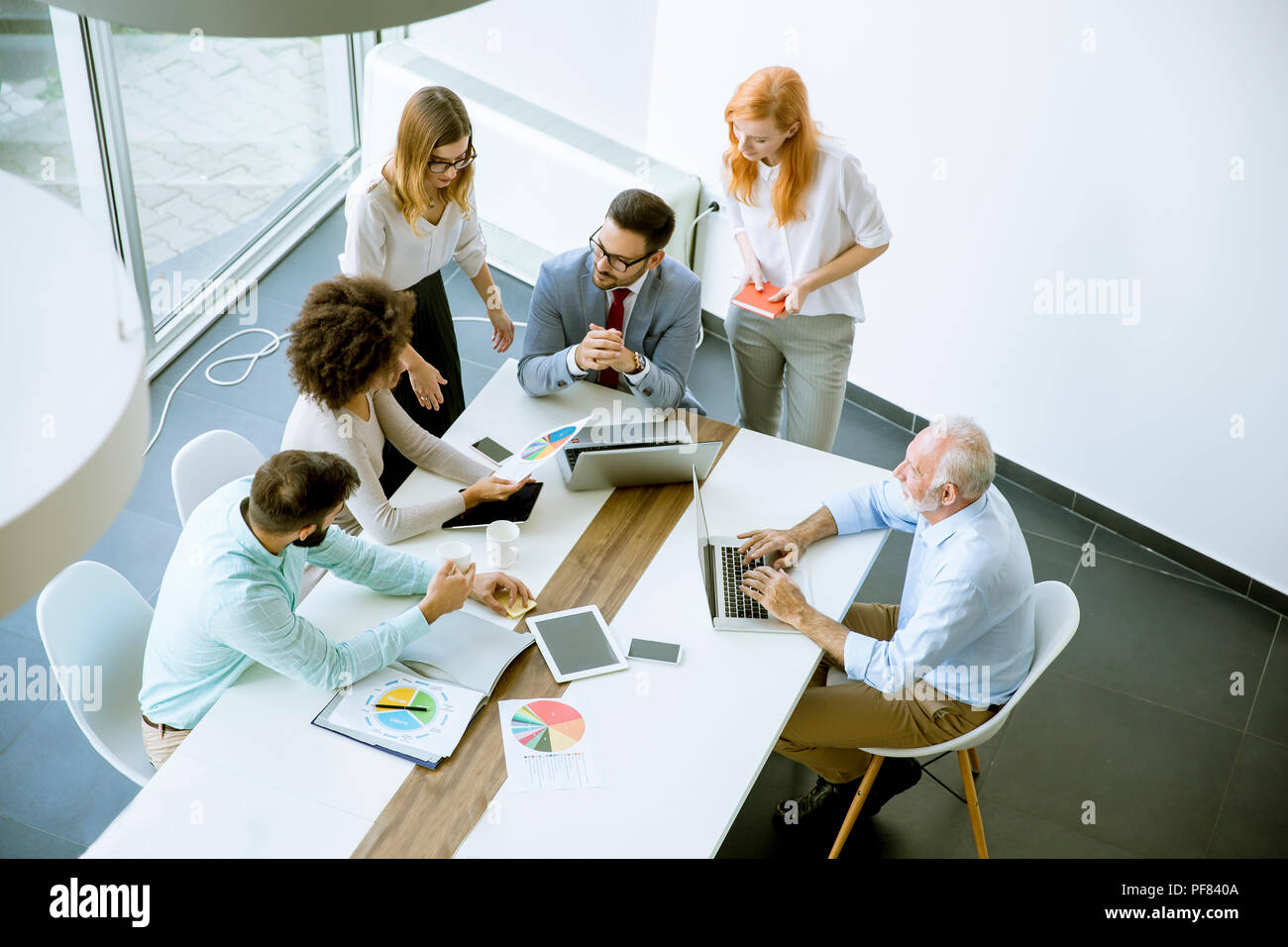 Top view at business people working in office Stock Photo - Alamy