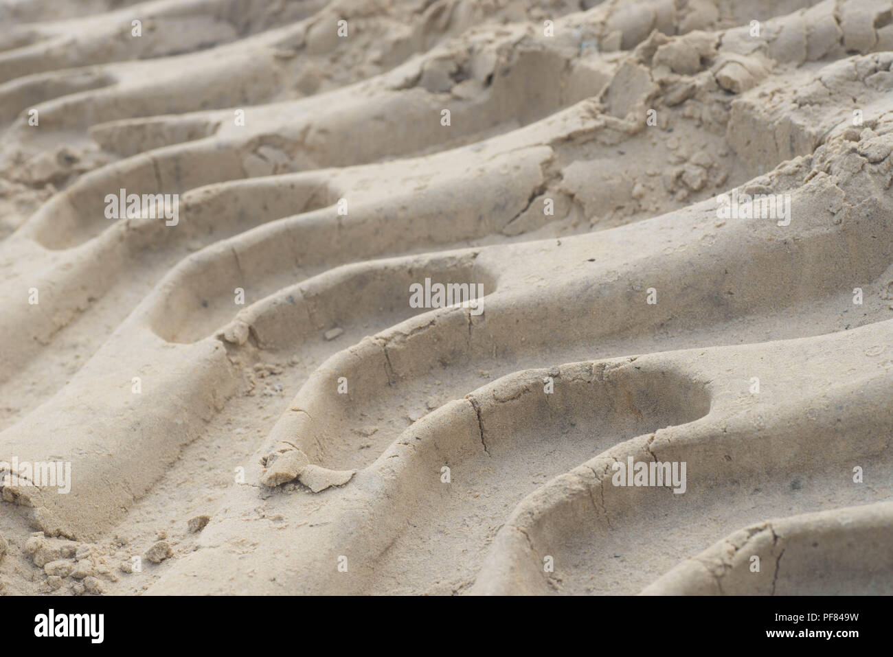 tractor tyre imprints in sand macro Stock Photo - Alamy