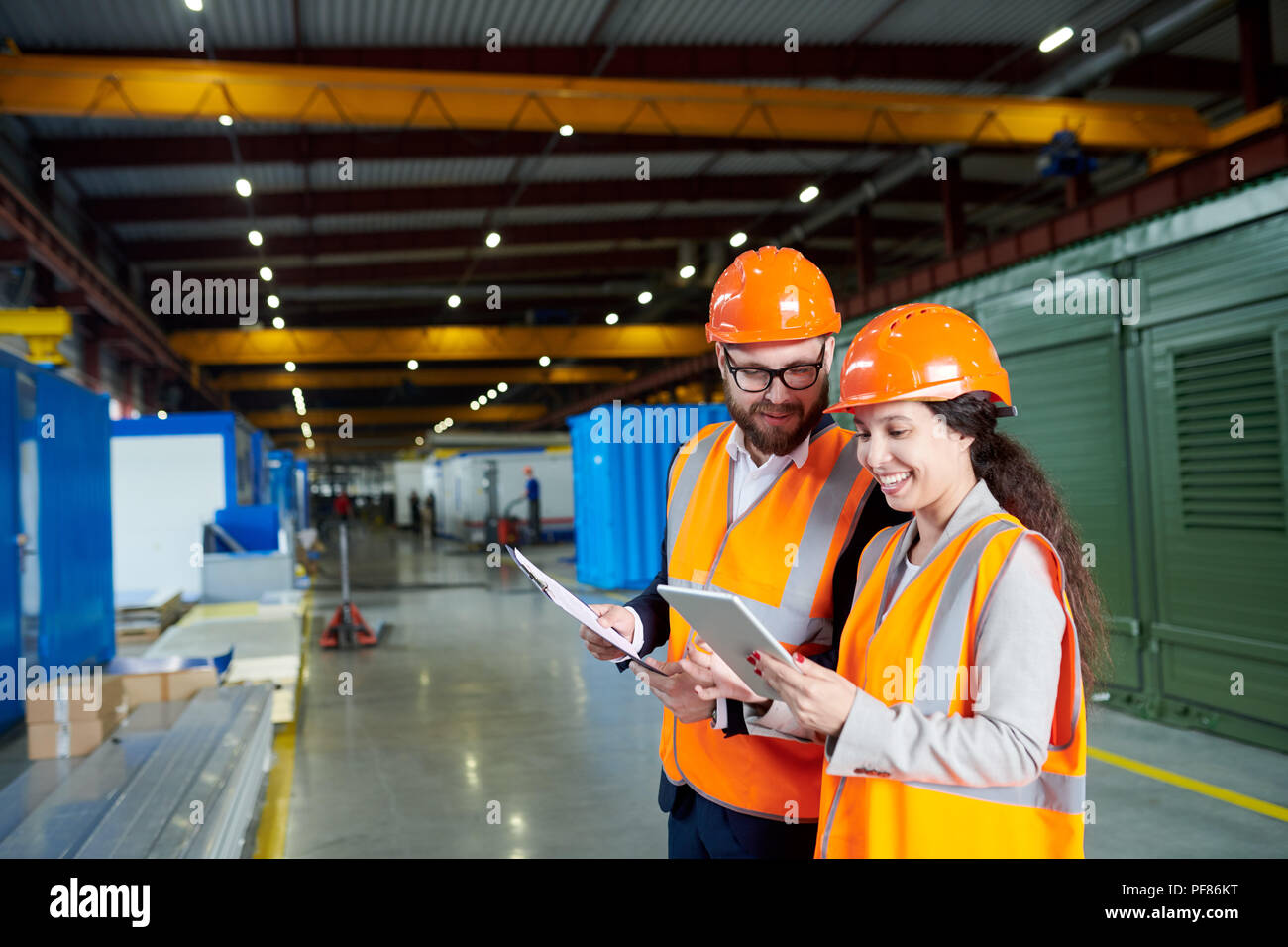 Cheerful Factory Workers Stock Photo - Alamy
