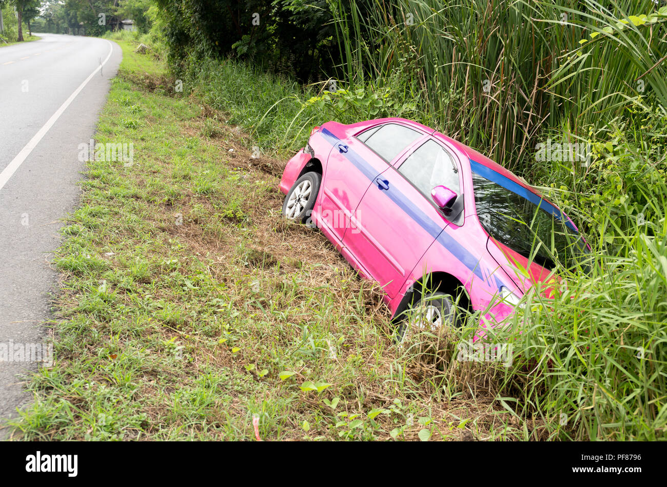 Road accident car crash on the side of the road into the bush in ...