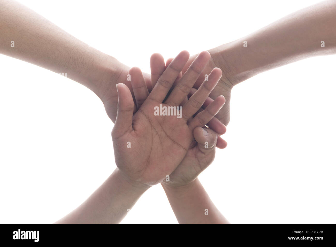 Conceptual people putting their hands working together as team work ...