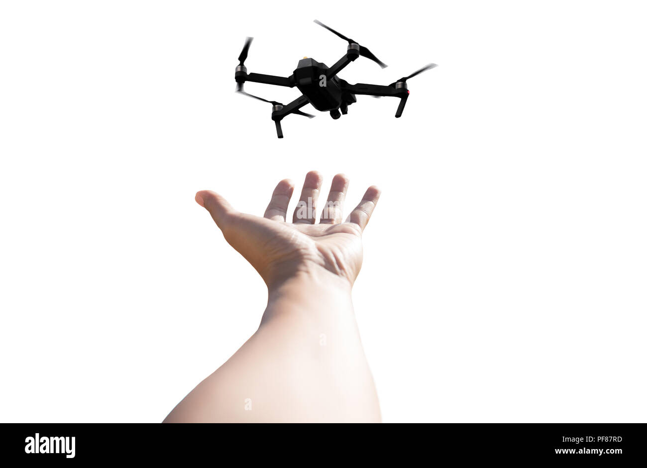 Hand with Quadcopter Drone isolated in white background Stock Photo - Alamy