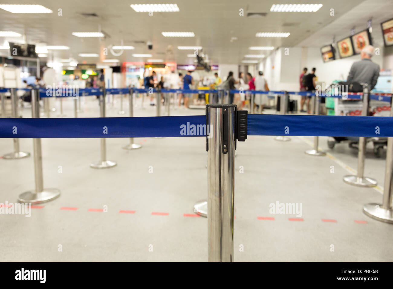 Passengers check-in line at the airport on vacation Stock Photo - Alamy
