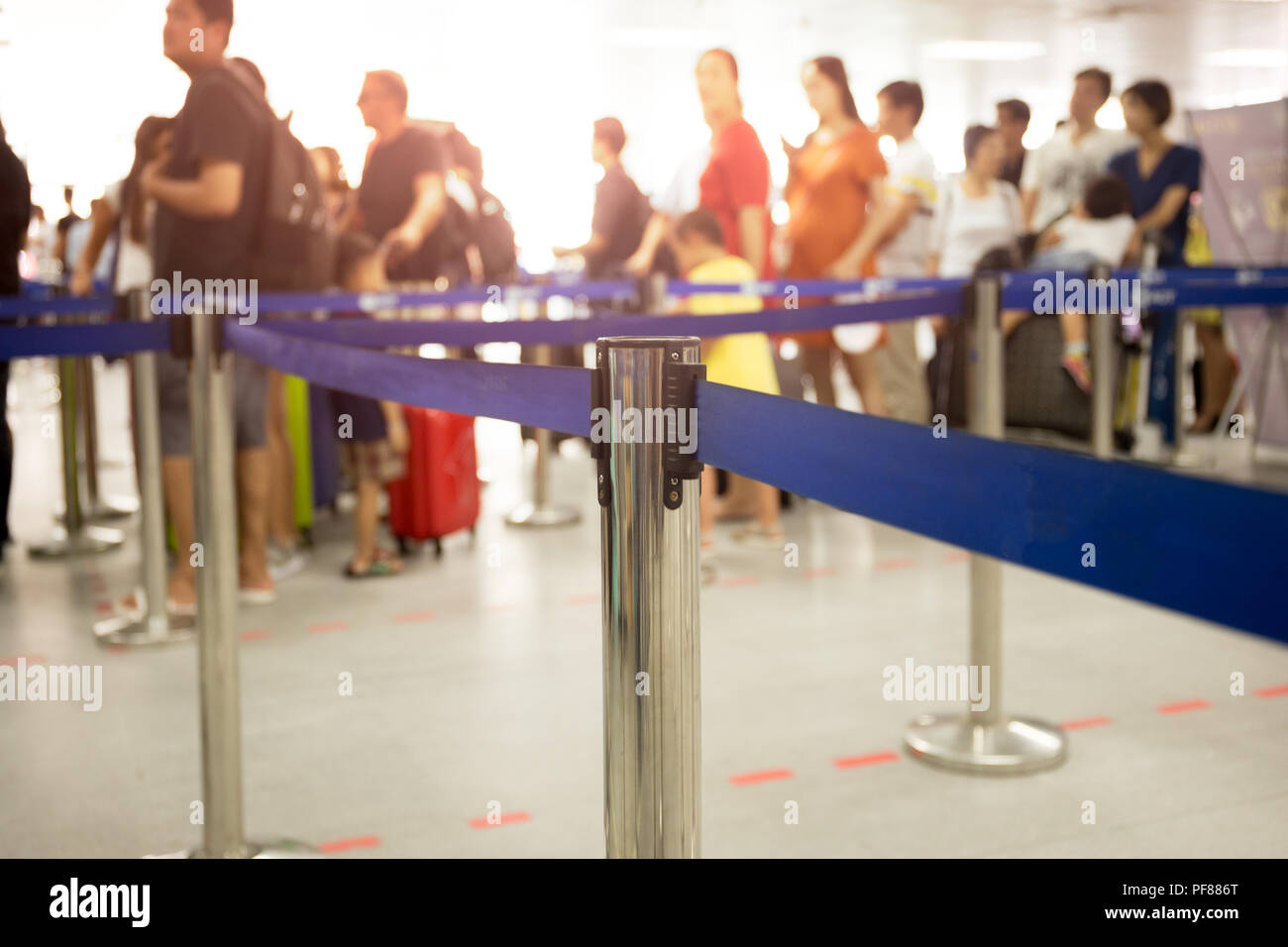 Passengers check-in line at the airport on vacation Stock Photo - Alamy