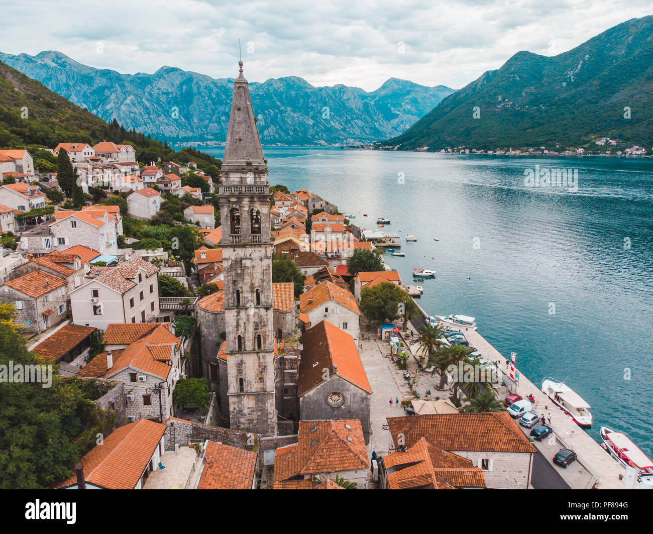 aerial view of old european city with sea and mountains in background ...
