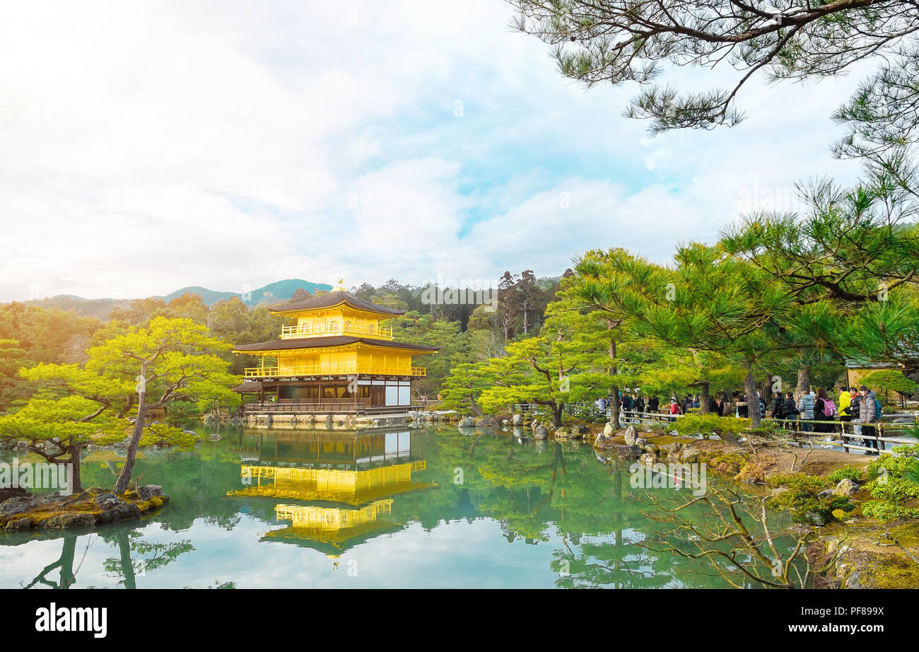 The world cultural heritage, Kinkaku Ji under dramatic morning sunshine ...