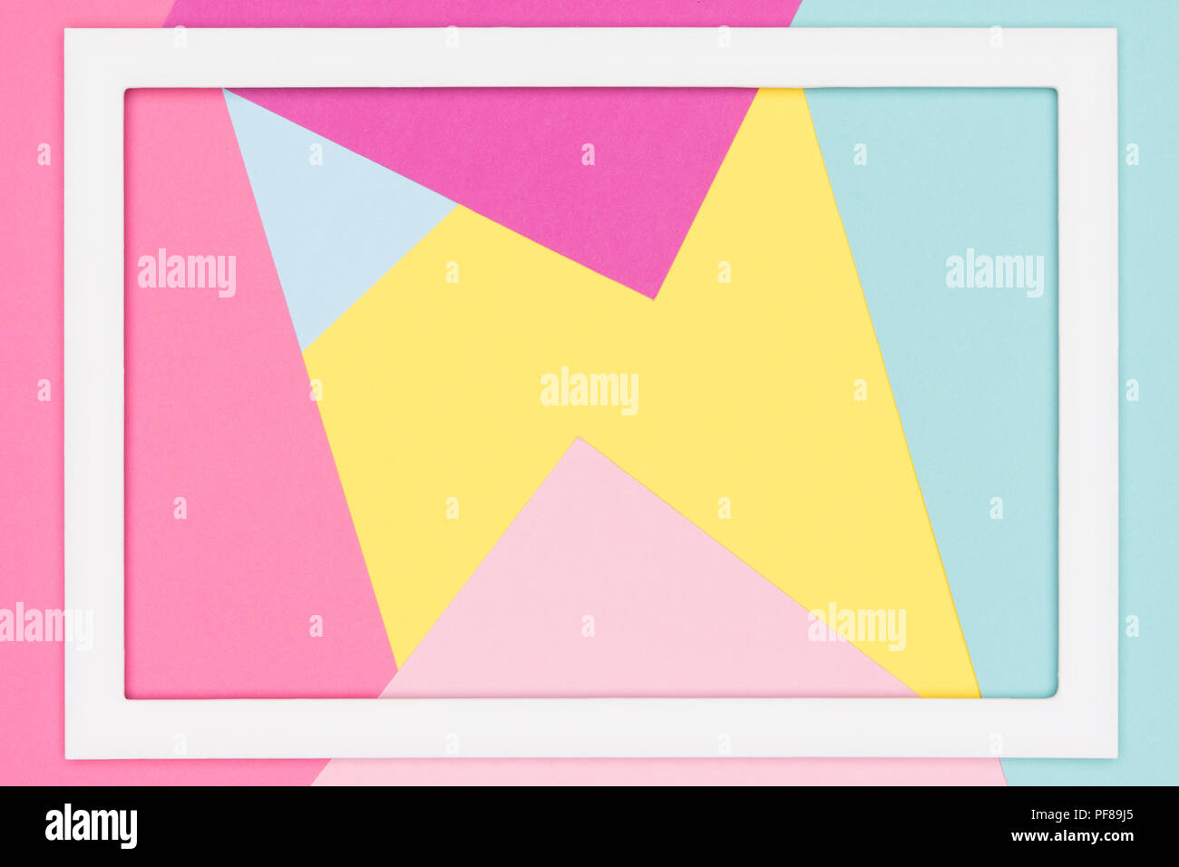 Abstract geometrical pastel blue, yellow and pink paper flat lay ...