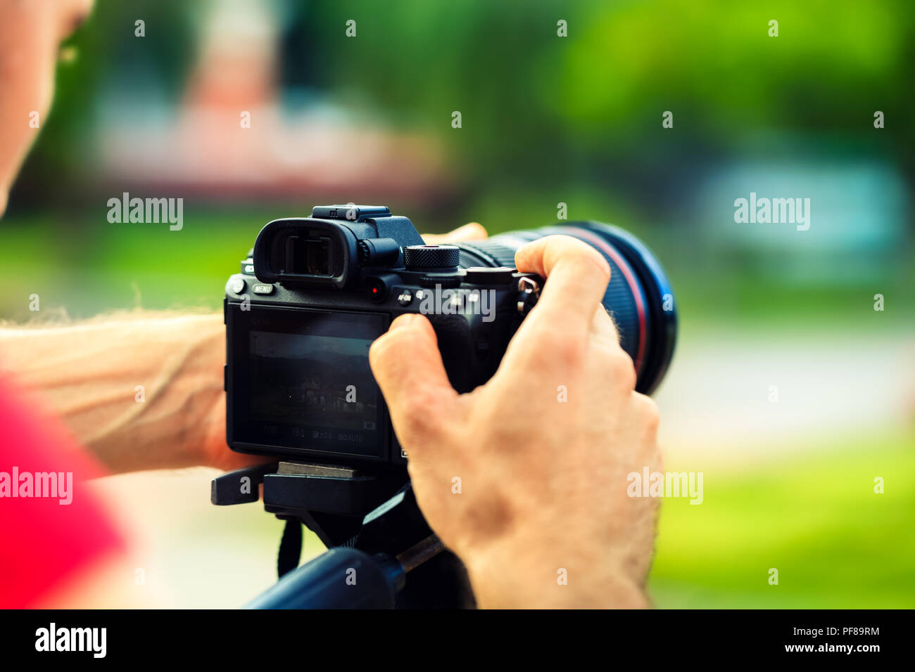 Hand holding professional camera hi-res stock photography and images ...