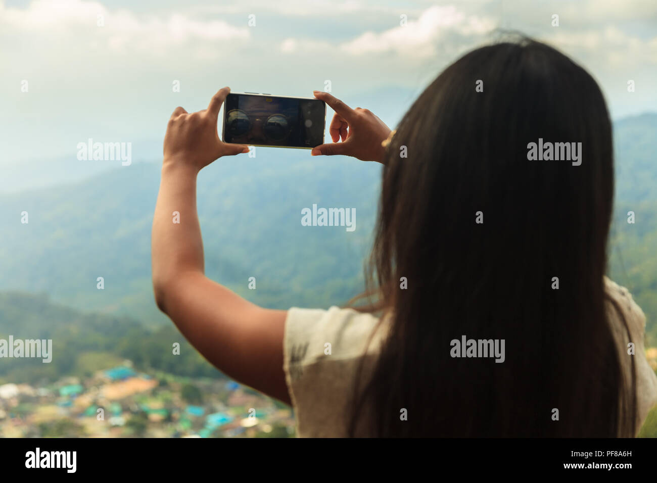 Traveling along Asia, active lifestyle concept. Woman make travel photo ...