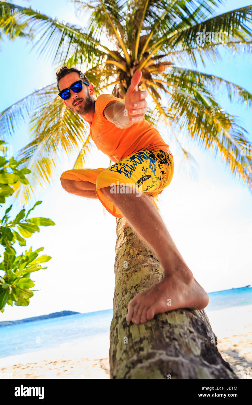 Happy travel tourist men enjoy vacation on tropical beach Stock Photo ...