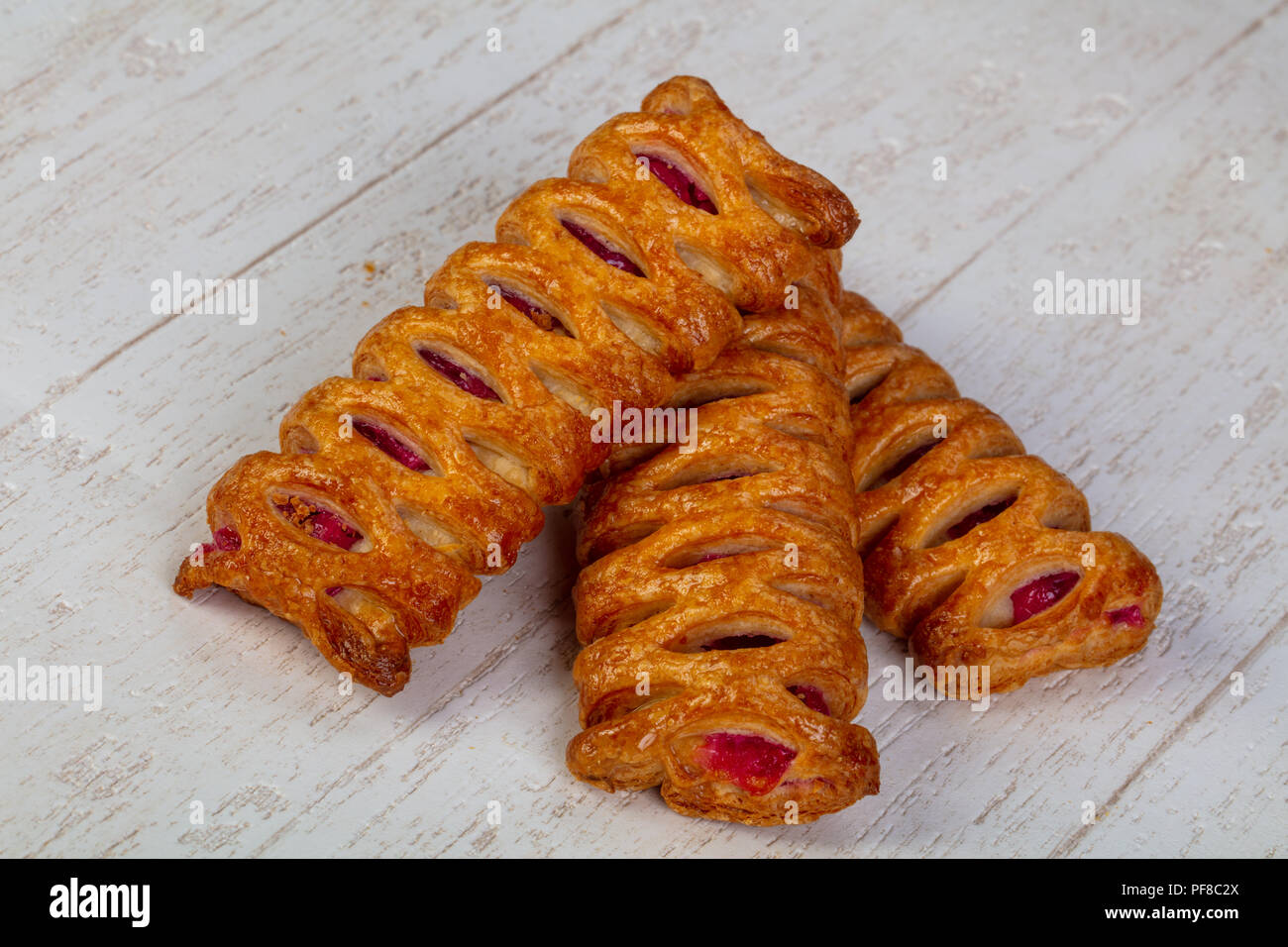 Delicious puff pastry strudel with jam Stock Photo - Alamy