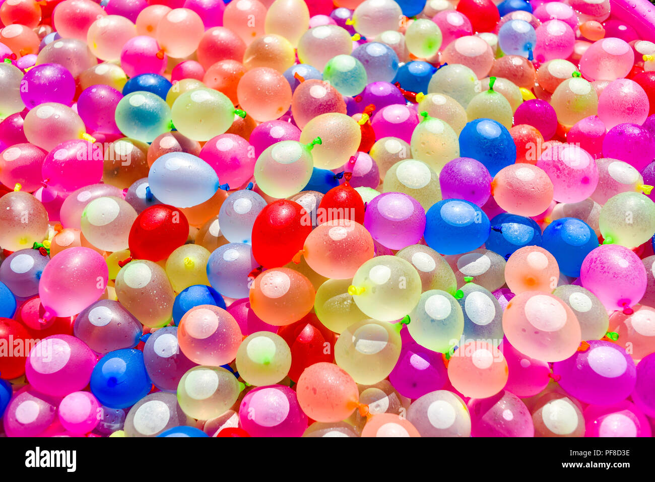 Colorful balloons filled with water. Texture of colorful balloons ...