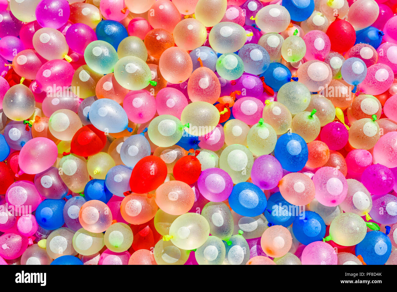Colorful balloons filled with water. Texture of colorful balloons ...