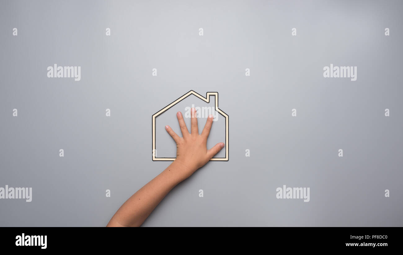 Child indicating his love for his home in a conceptual image with his ...