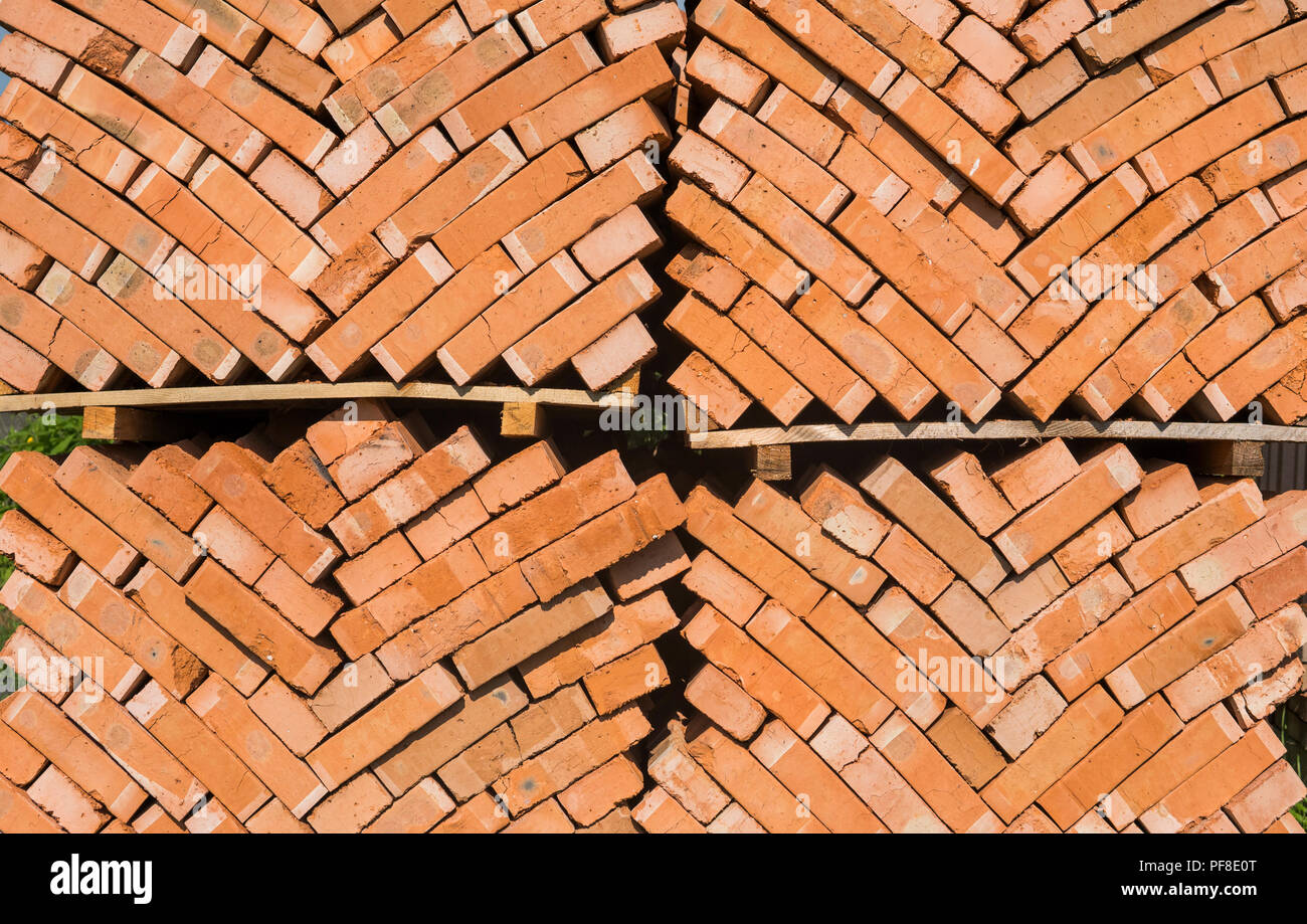 Stack of red bricks as a background or texture Stock Photo - Alamy