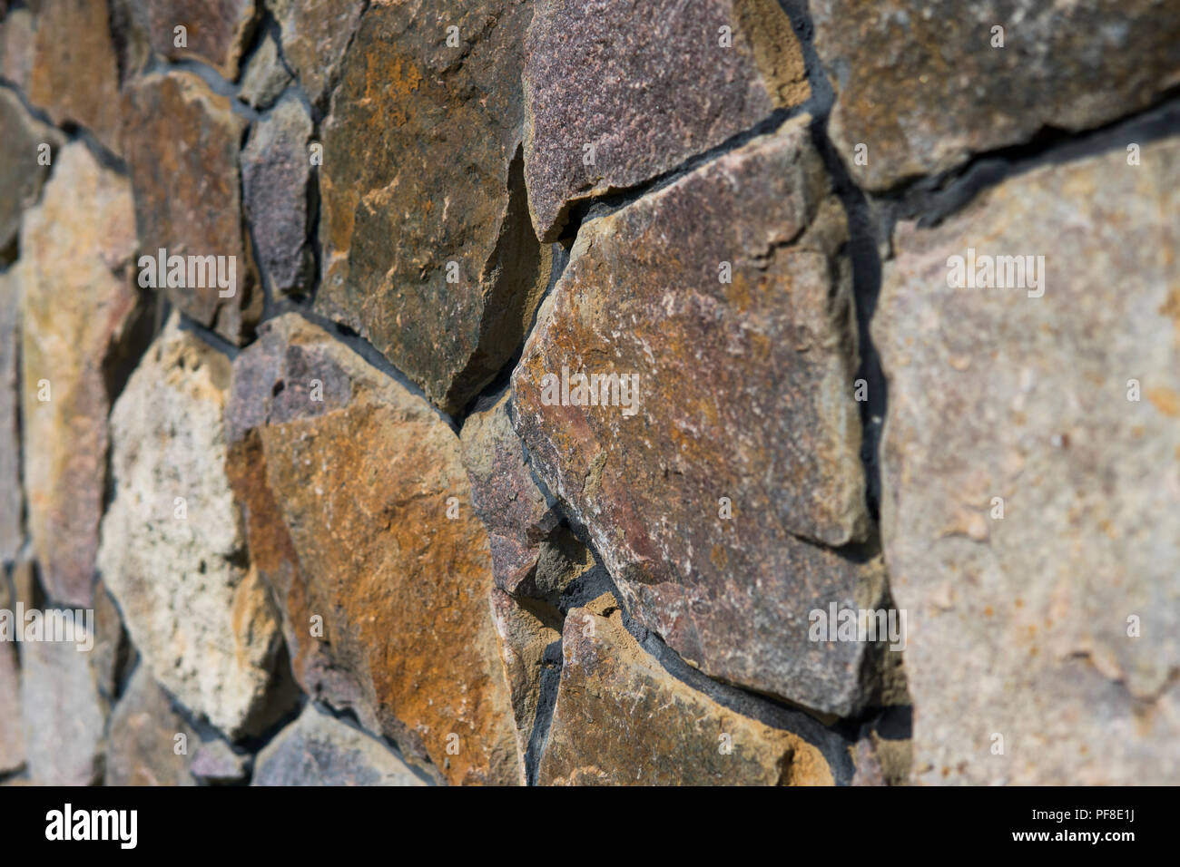 Close-up of surface of natural stone fence. Stone wall as a background ...