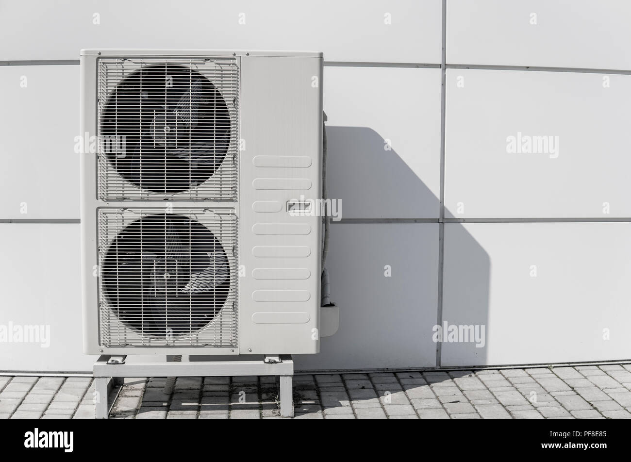 Exterior air conditioning unit on a wall Stock Photo - Alamy