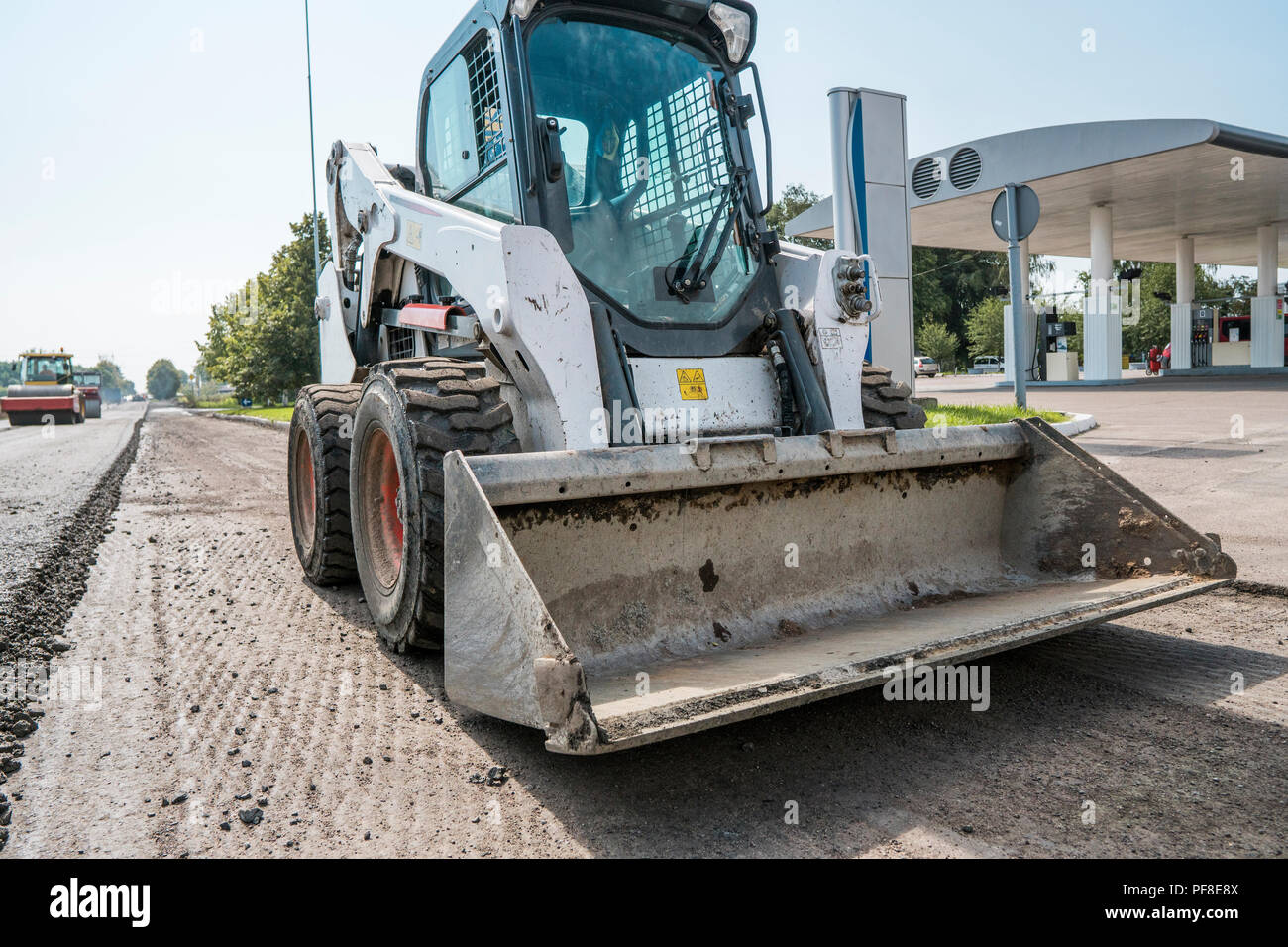 Asphalt paver machine during road construction and repairing works. A ...
