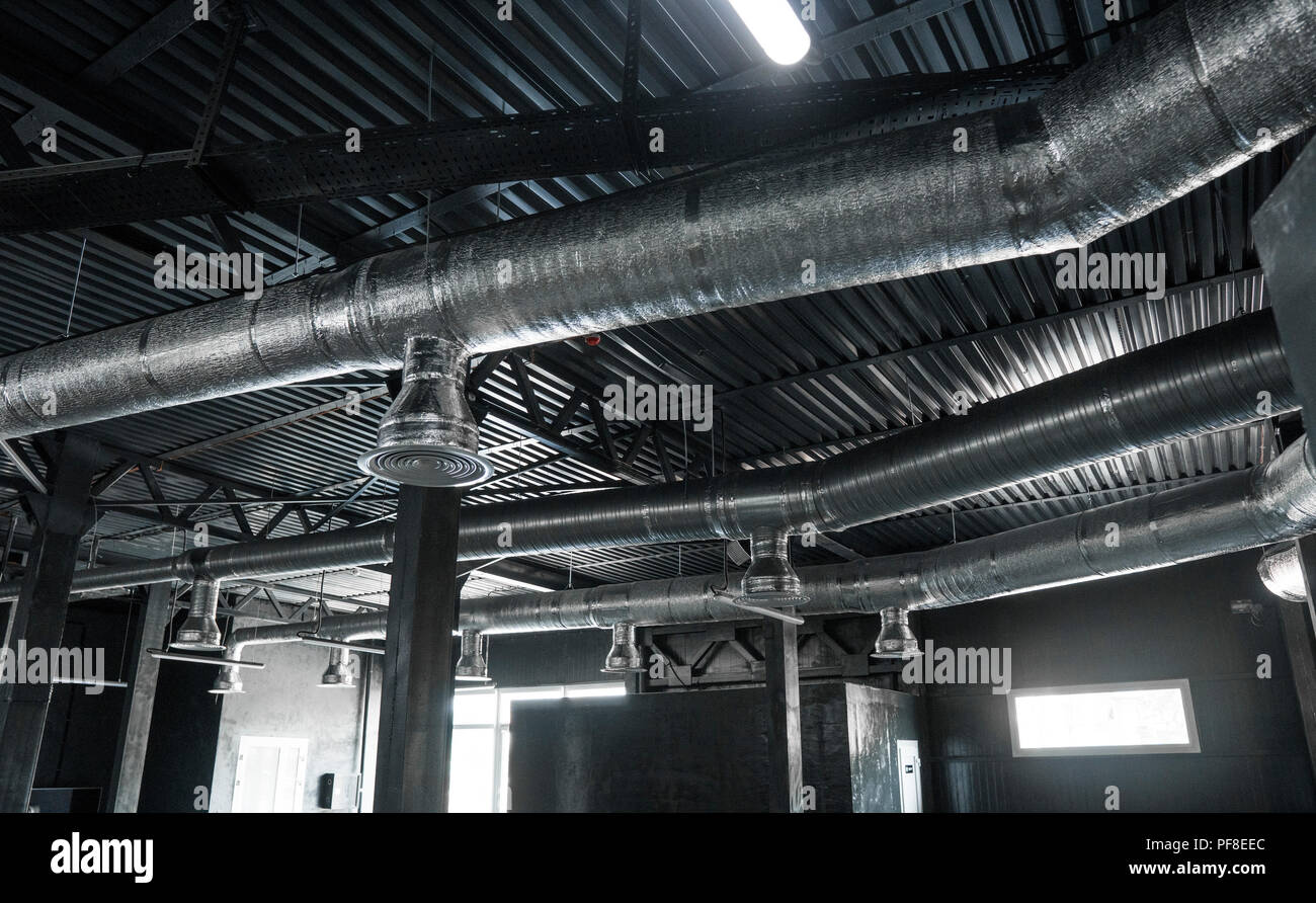 Ventilation system on the ceiling of large buildings. Ventilation pipes ...