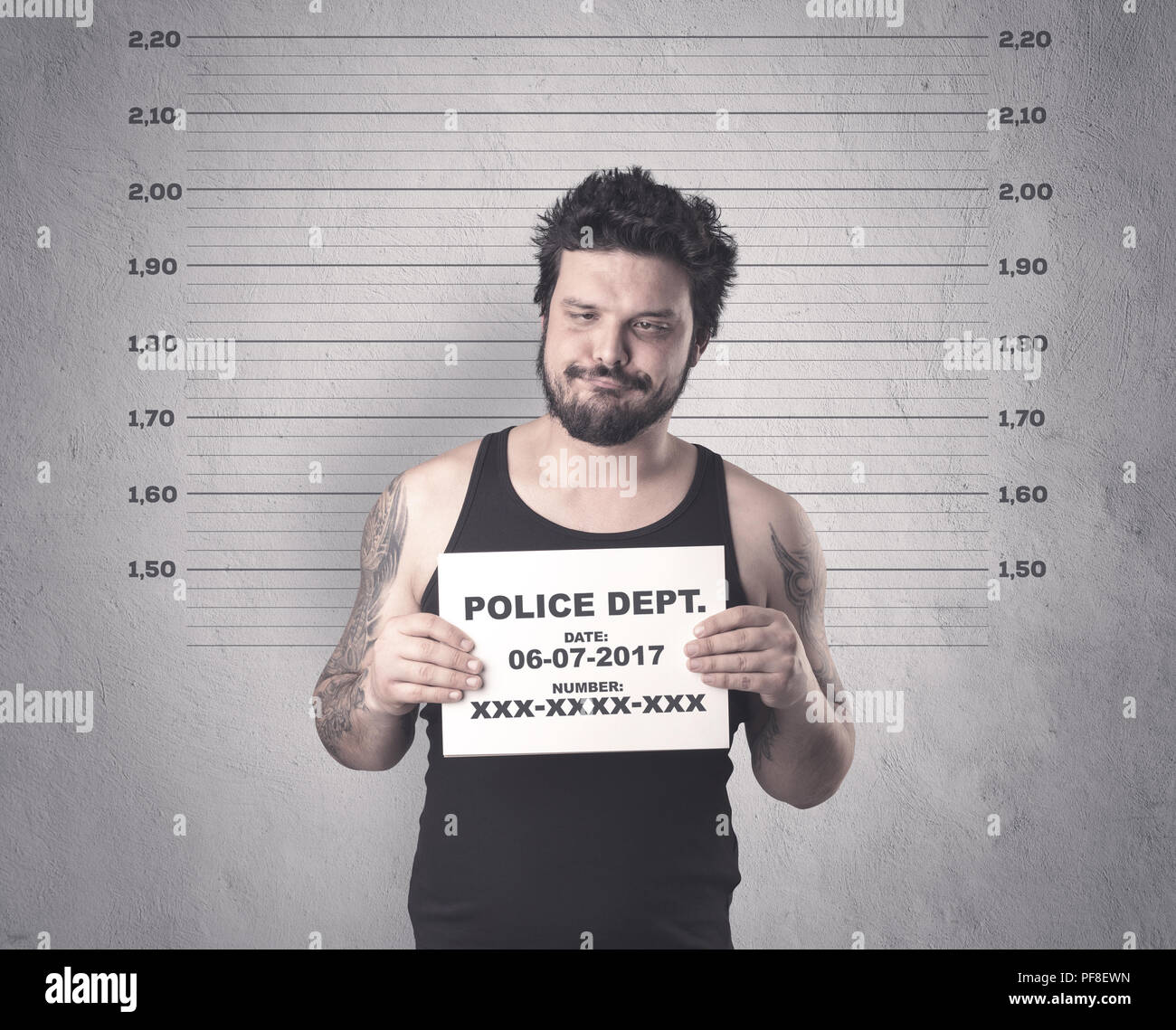 Caught gangster in jail with table on his hand Stock Photo - Alamy