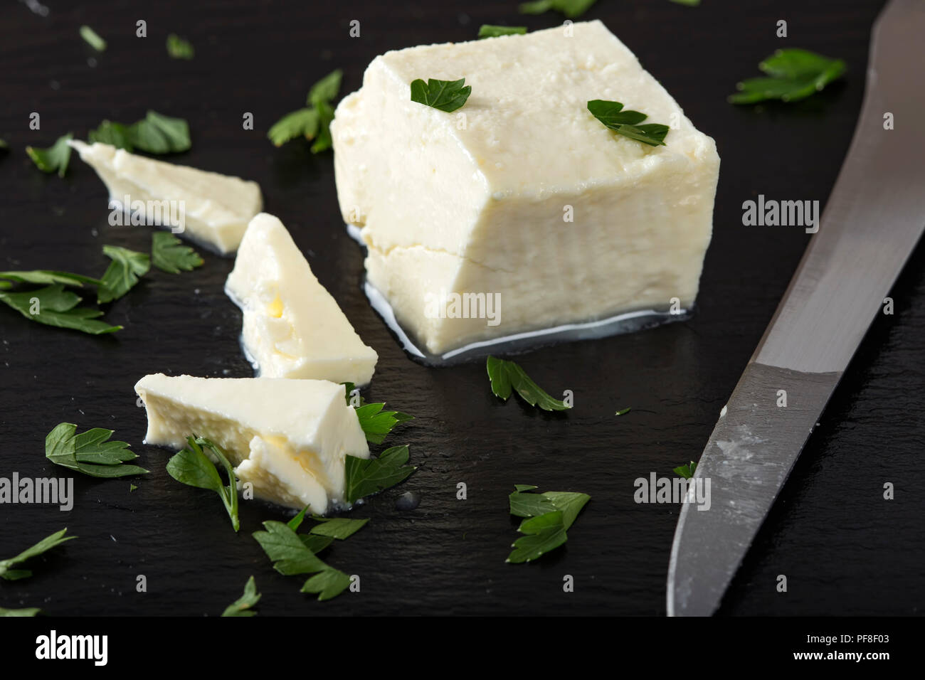 Telemea cheese - Romania traditional food and a kitchen knife Stock ...