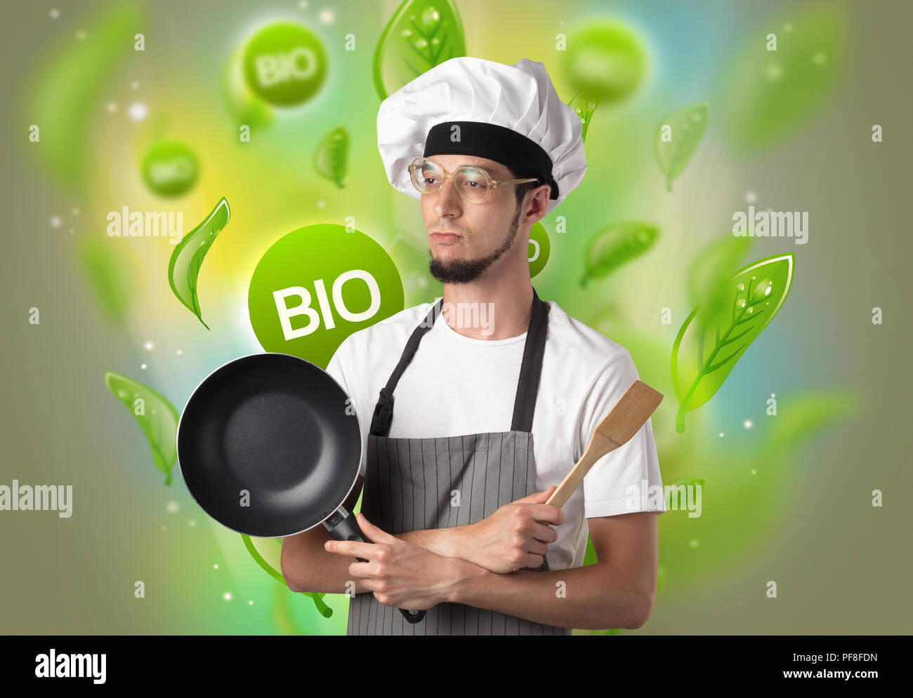 Green bio leaves concept and cook portrait with kitchen tools Stock ...