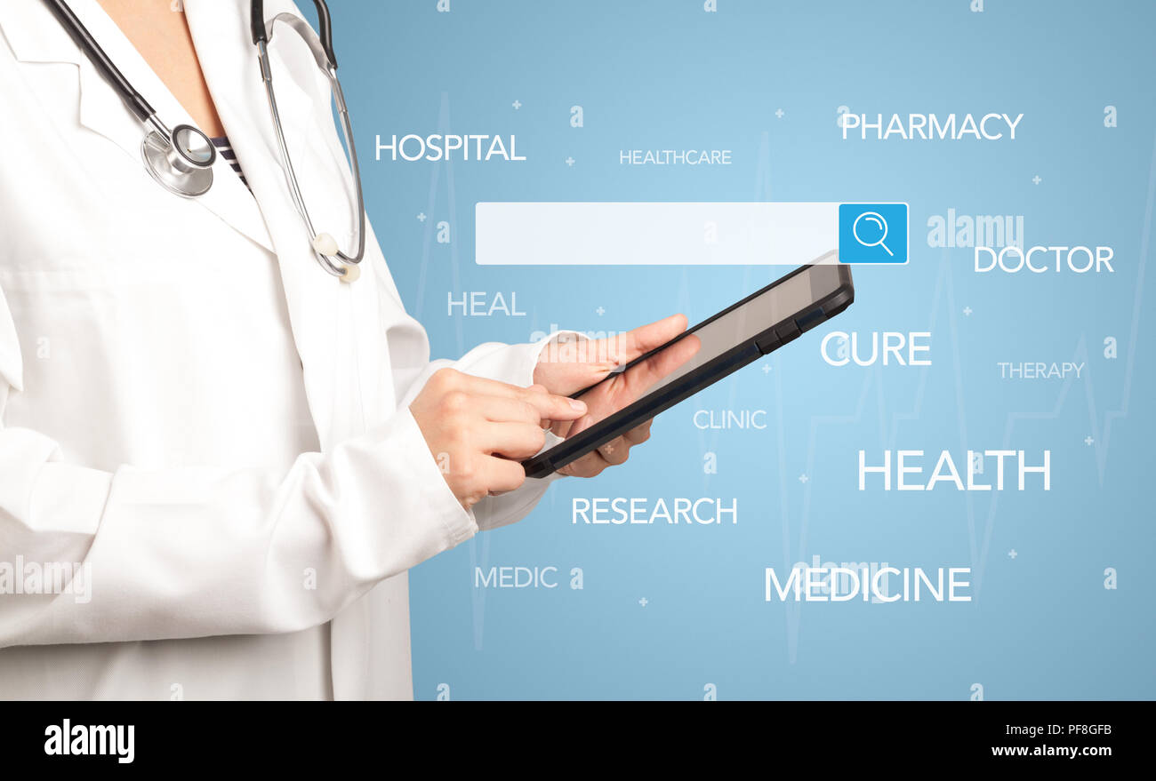 Female doctor holding tablet with blue background and search bar with ...
