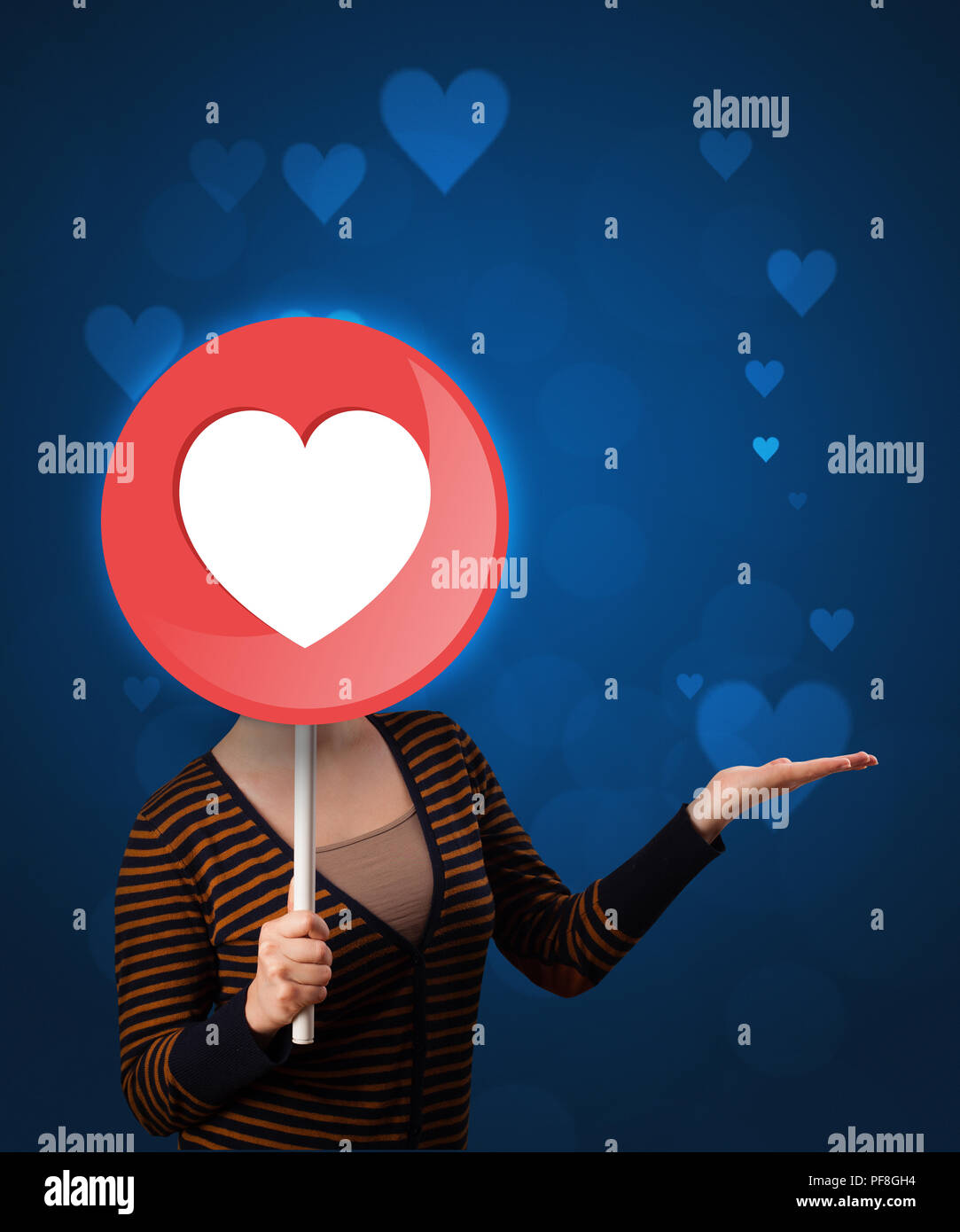 Casual young woman holding round sign with heart Stock Photo - Alamy