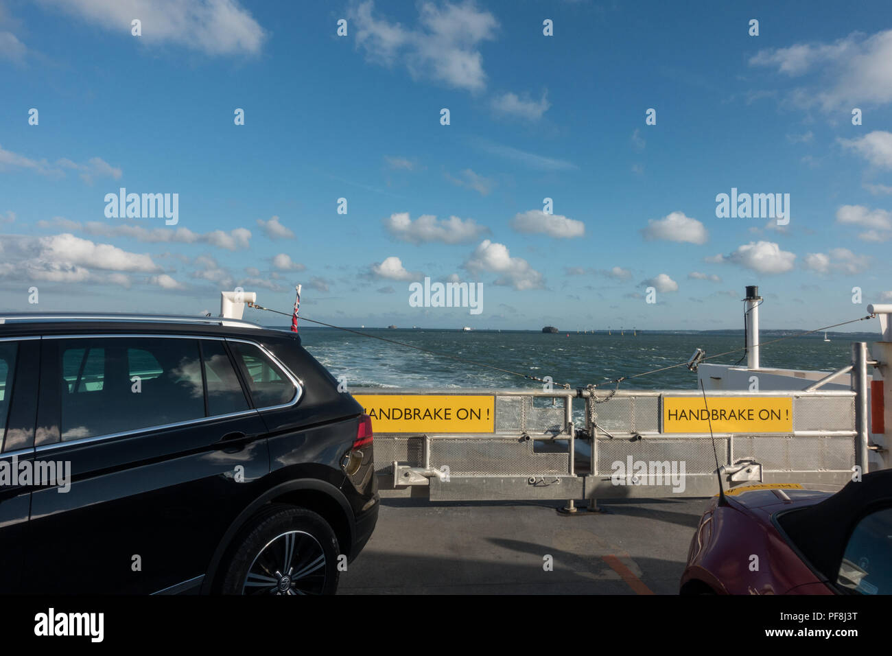 car ferry transporting vehicles across a body of water Stock Photo - Alamy