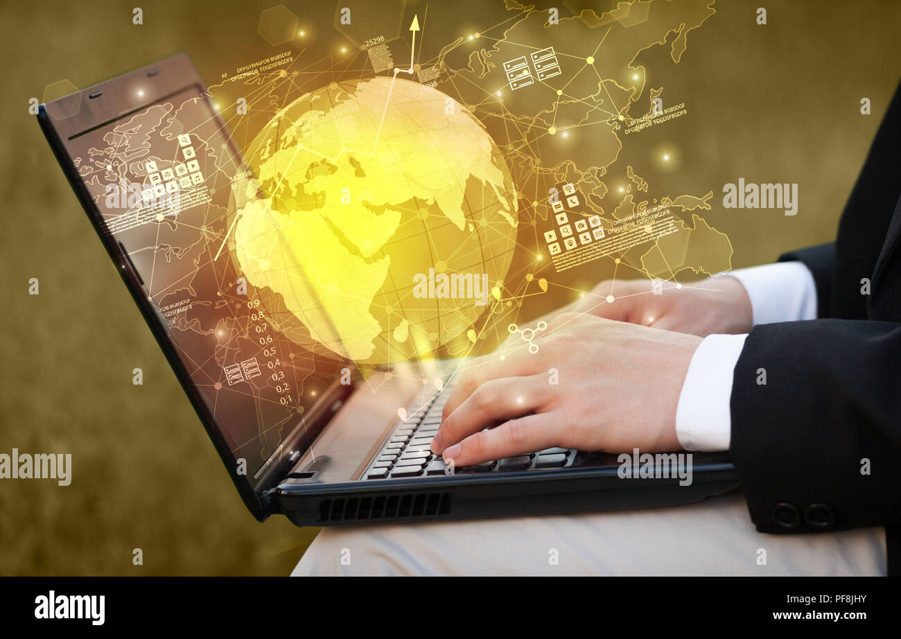 Hand using laptop with global reports and stock market change concept ...
