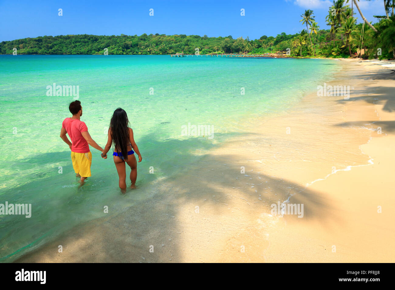 Loving couple tourist enjoy honeymoon vacation on the tropical beach ...