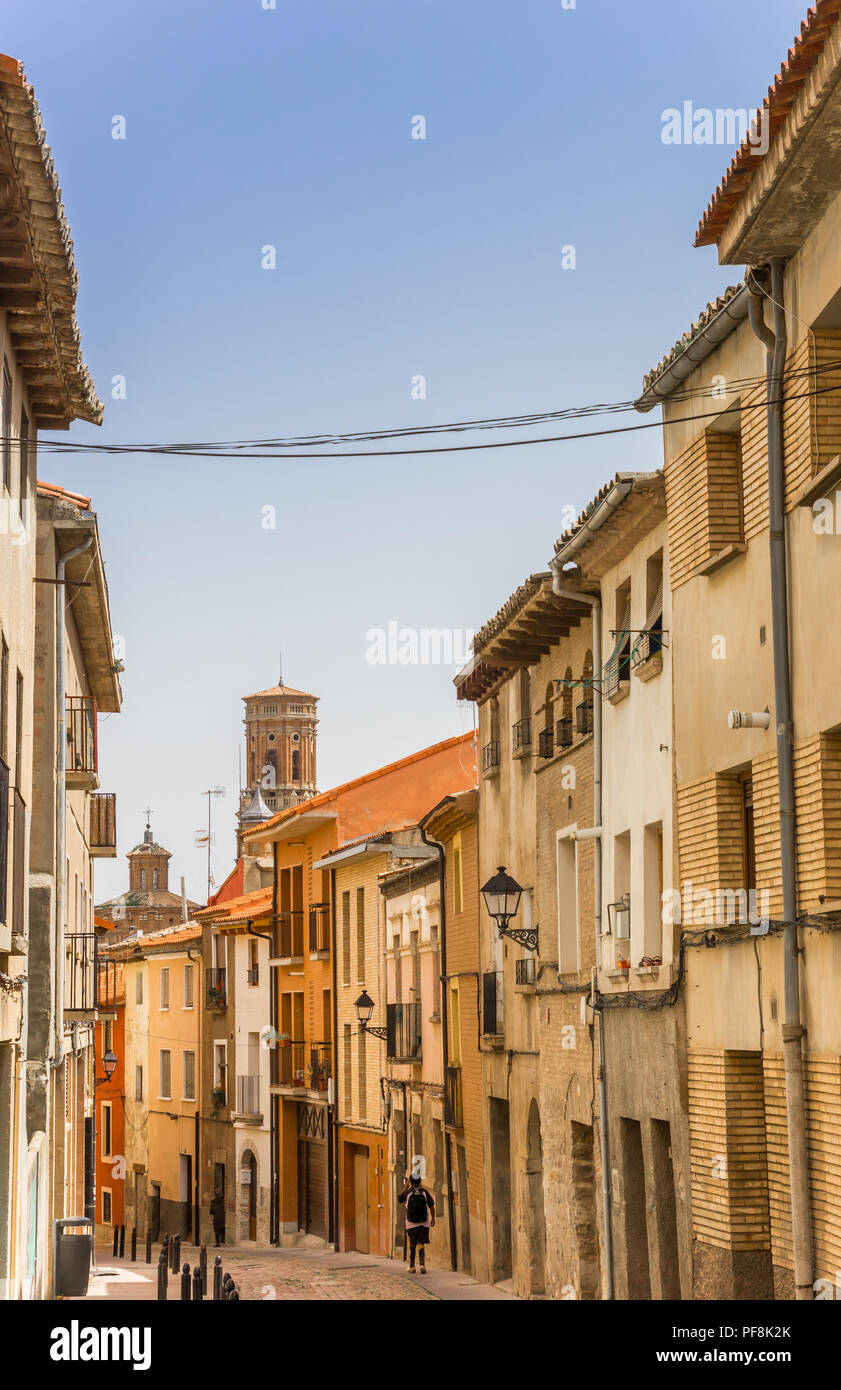 Street with colorful houses and cathedral tower in Tudela, Spain Stock ...