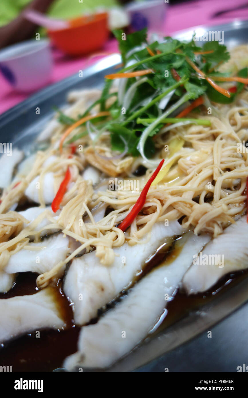 Steamed fish with soy sauce traditional chinese cuisine Stock Photo - Alamy