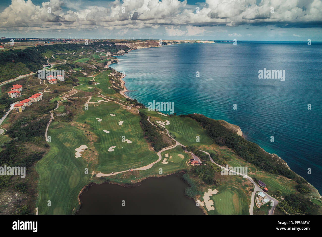 Aerial panorama view of a golf course next to the cliffs and Black sea ...