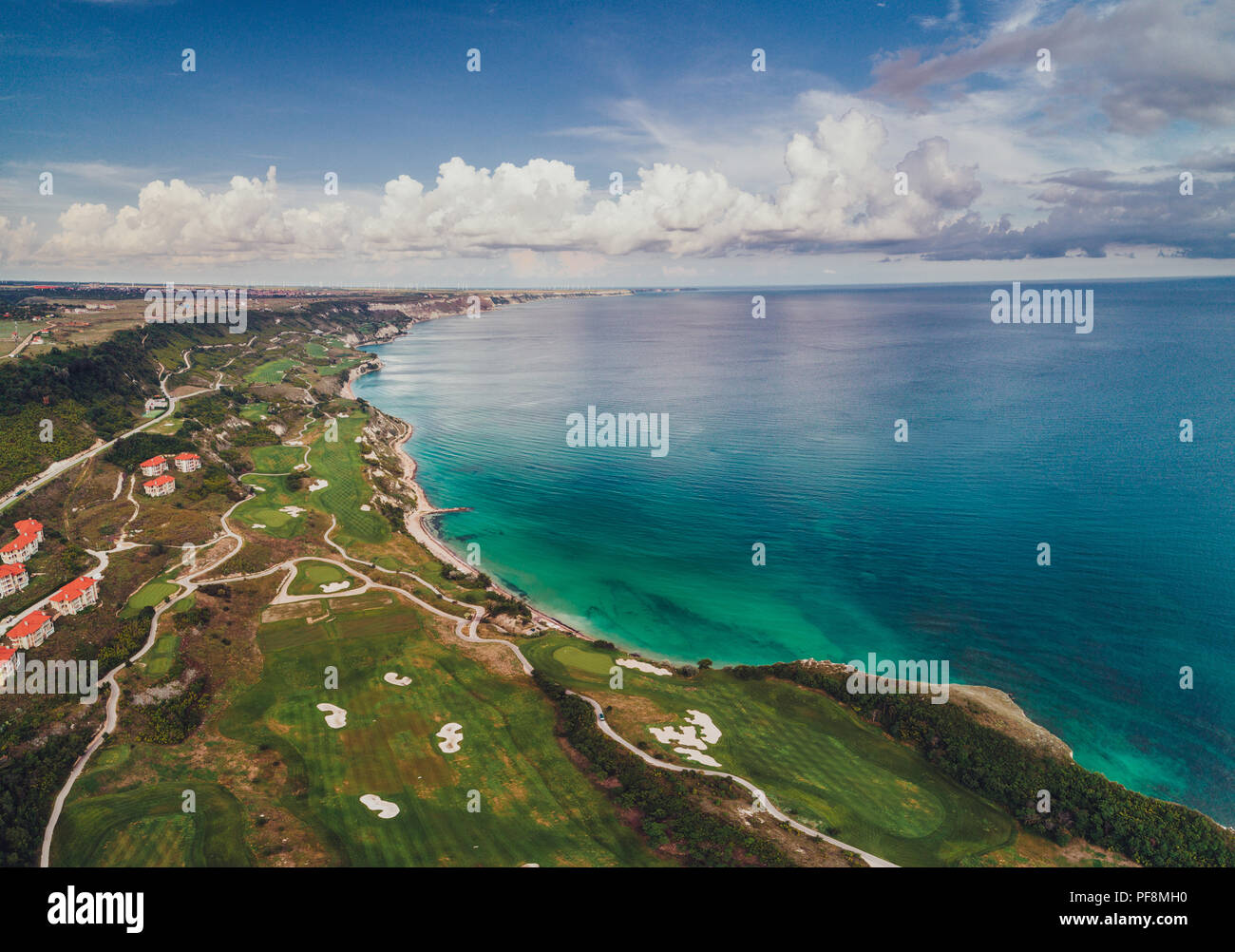 Aerial panoramic view of a golf course next to the cliffs and Black sea ...