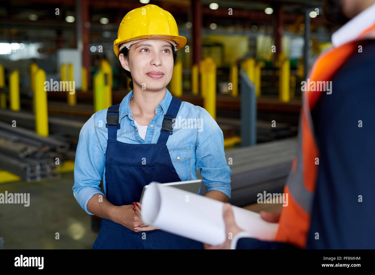 Female Factory Worker Listening to Foreman Stock Photo - Alamy