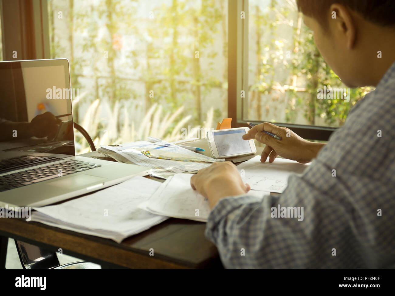 Interior designer hands busy using cell phone calculating sittin Stock ...