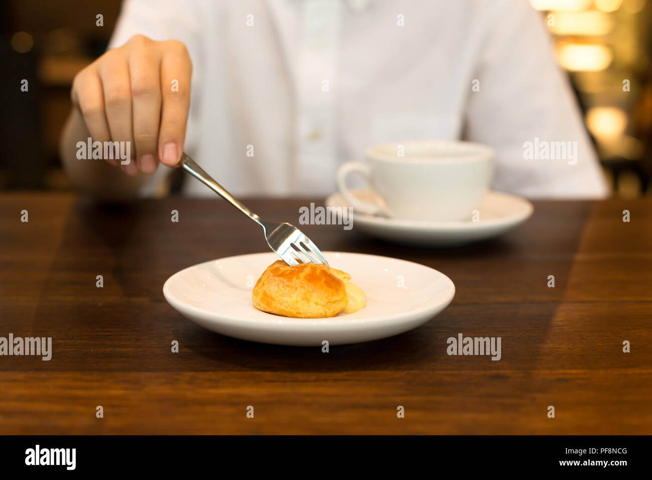 Eating eclair hi-res stock photography and images - Alamy