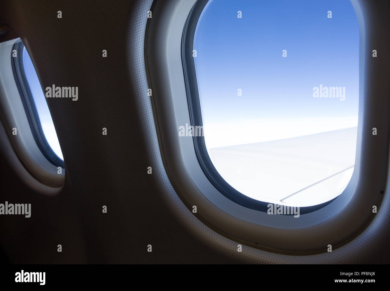 View of clear sky from airplane window i Stock Photo - Alamy