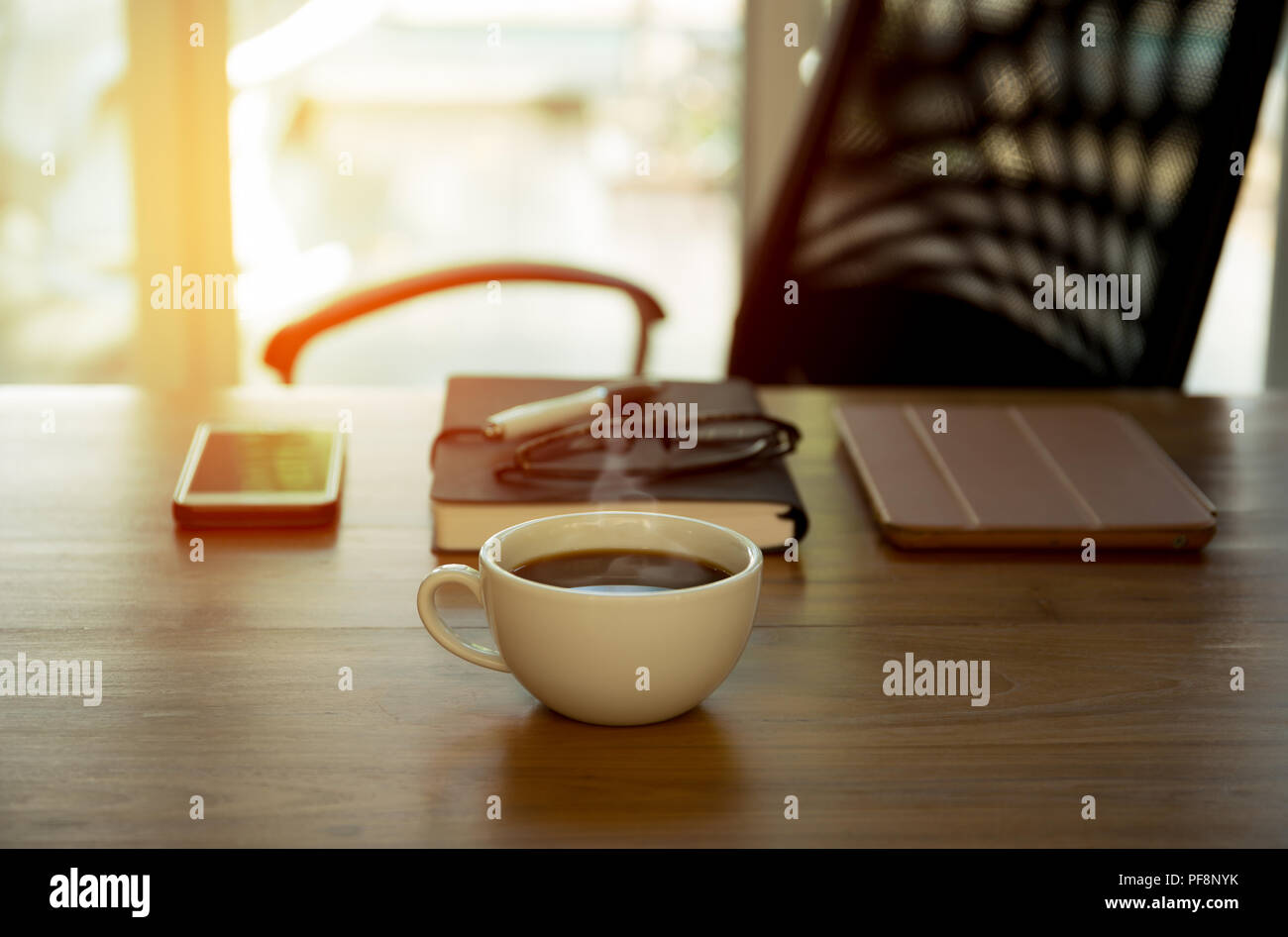 Hand holding measuring glass cup on in blur background Stock Photo - Alamy