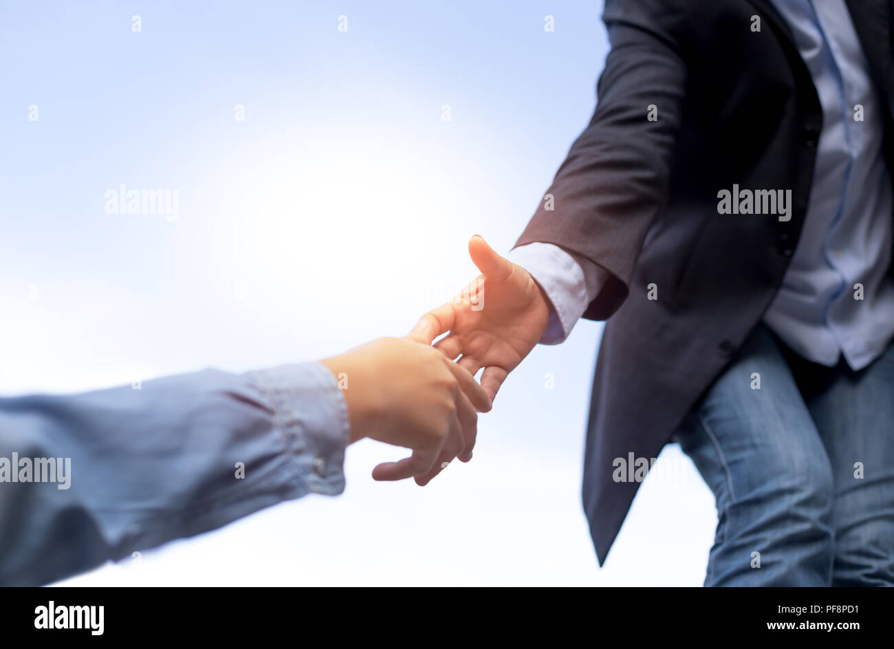 Help concept hand reaching out to help someone with blue sky Stock ...