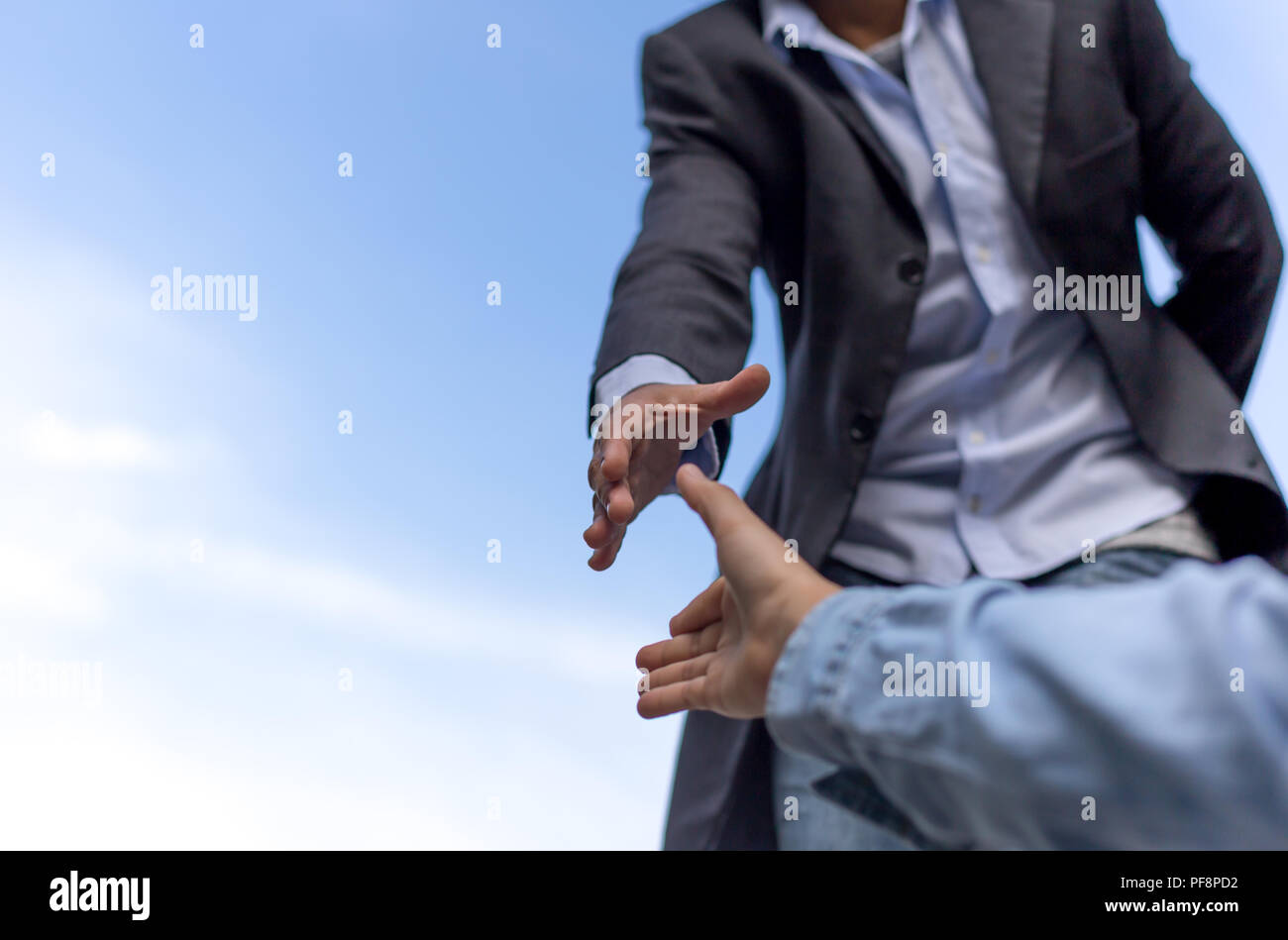 Help concept hand reaching out to help someone with blue sky Stock ...