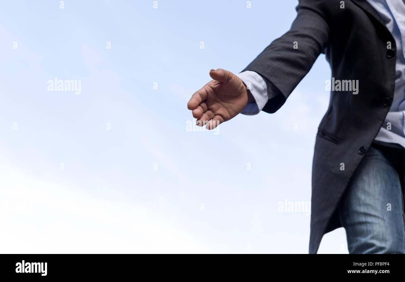 Help concept hand reaching out to help someone with blue sky Stock ...