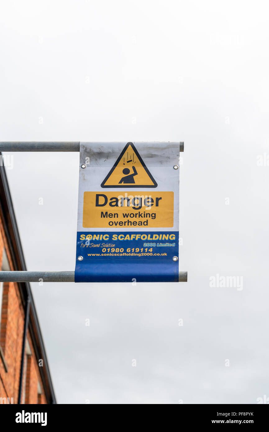 Danger men working overhead safety sign Stock Photo - Alamy