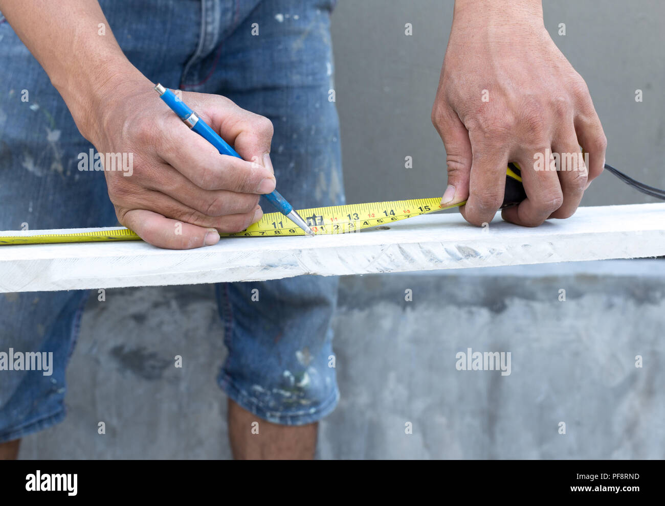Carpenter hand measuring tape with pencil Stock Photo - Alamy