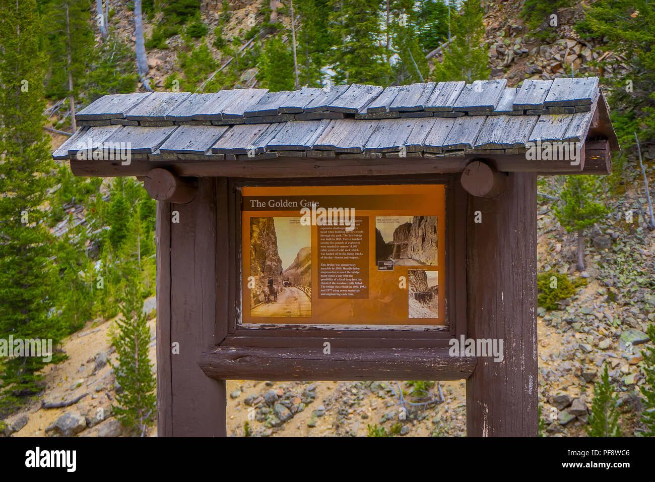 Yellowstone's Grand Loop Road passes through the Golden Gate surrounded ...