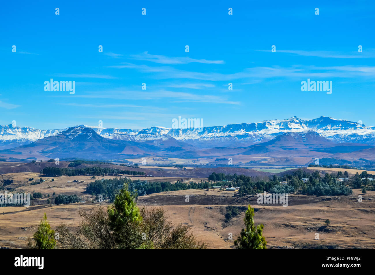 Landscape of Underberg , a small countryside village with snow clad ...