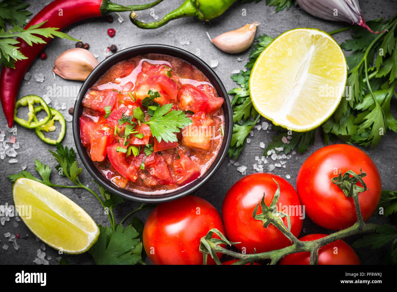 Traditional Latin American mexican salsa sauce and ingredients on black ...