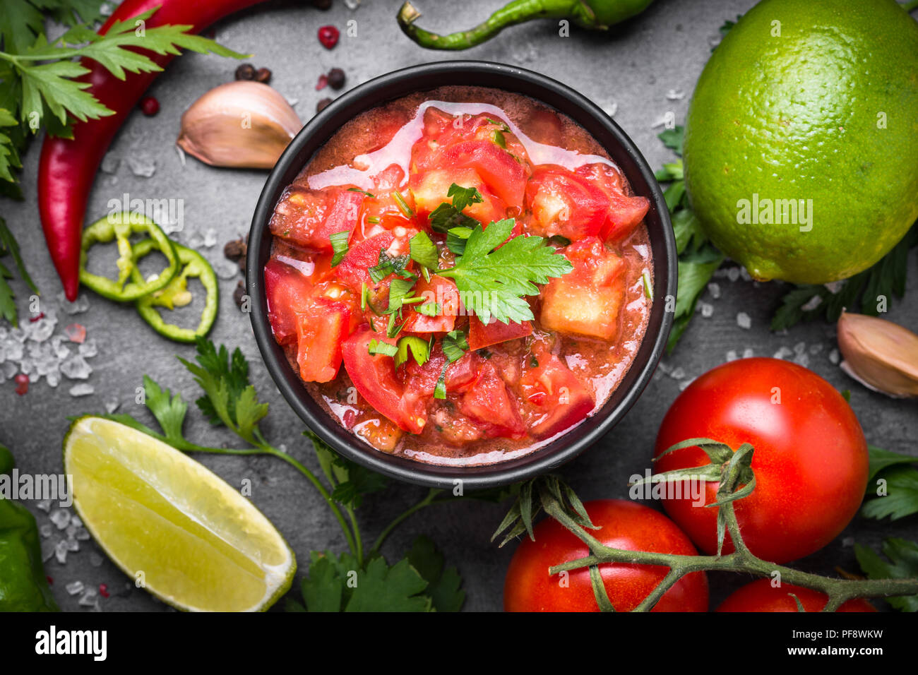Traditional Latin American mexican salsa sauce and ingredients on black ...