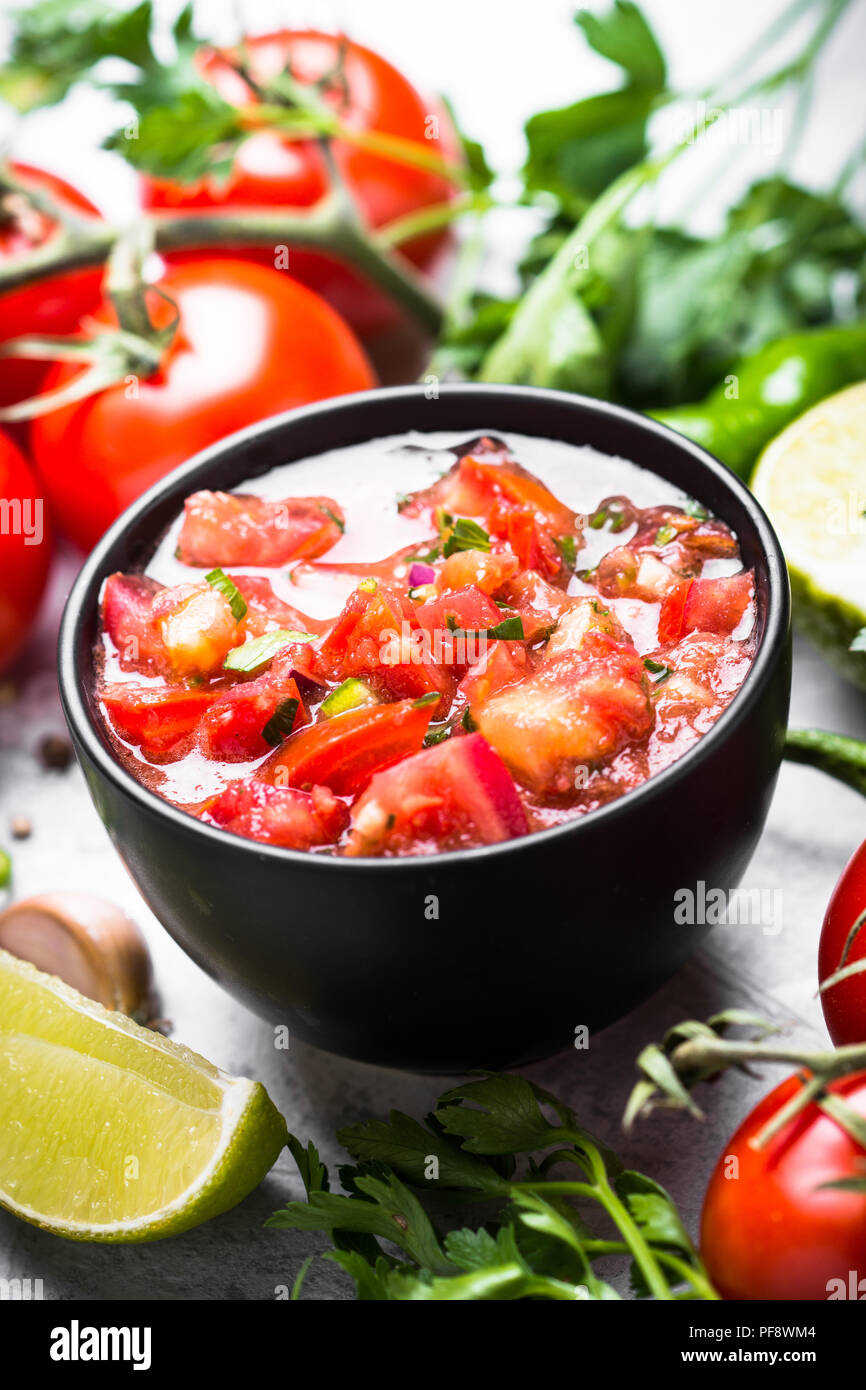 Traditional Latin American mexican salsa sauce and ingredients on black ...